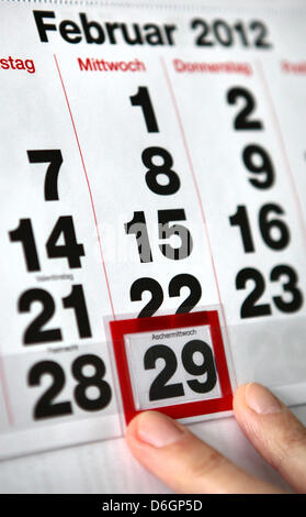 Radio host Bernadette Hirschfelder points to the calendar page of ...