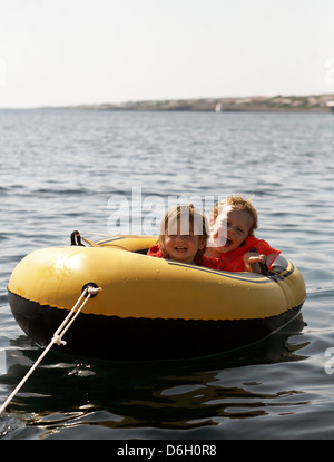 fun in riding an inflatable boat pulled by an outboard motor Stock ...