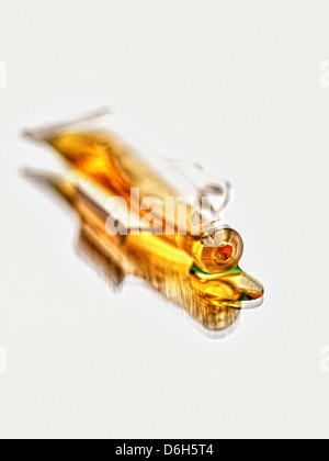 Close up of spilled vial of liquid Stock Photo - Alamy