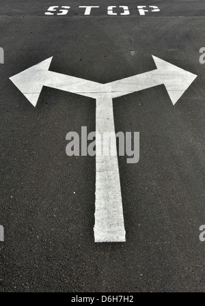 Stop road markings at a Junction Stock Photo - Alamy
