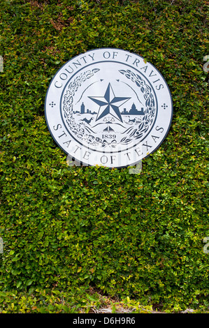 USA Texas TX Travis County State Seal on a hedge wall Austin Stock ...