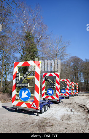 traffic warning signs on wheels Stock Photo - Alamy