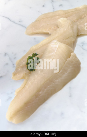Fresh raw cod fish fillet, Boneless white fish meat. gray background ...