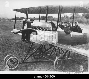 Glenn L. Martin, an aviation pioneer, is shown in a pusher-biplane, a ...