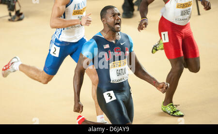 Justin Gatlin from the USA celerates with the mascots of the event ...