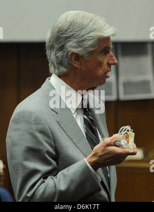 Defense witness Dr. Paul White pauses during a break in redirect ...