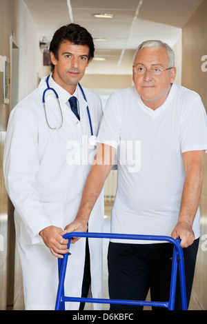 Handsome Doctor and his senior (older) patient discussing the symptoms ...