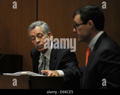 Defense attorney Ed Chernoff (R) approaches witness Cherilyn Lee (L), a ...
