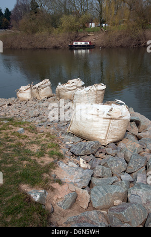 River Severn, flood defences, rocks, boulders, bank, mud, lichen ...