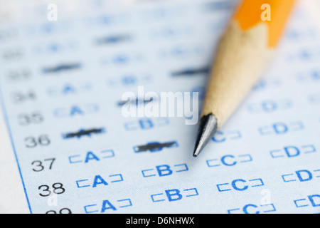 Optical scan answer sheet for a school exam with student erasing answer ...