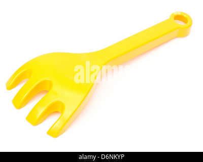 rake yellow toy Stock Photo - Alamy
