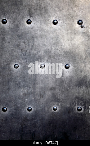 Black grunge metal plate or armour texture with rivets as background ...