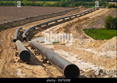 Natural gas pipeline construction work. A dug trench in the ground for ...