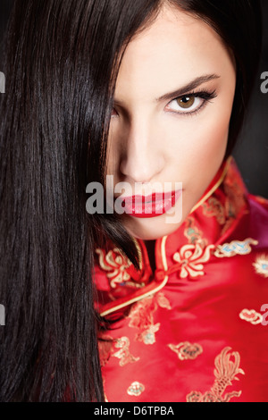 beauty woman wear red cheongsam looking and smile in chinese new year ...