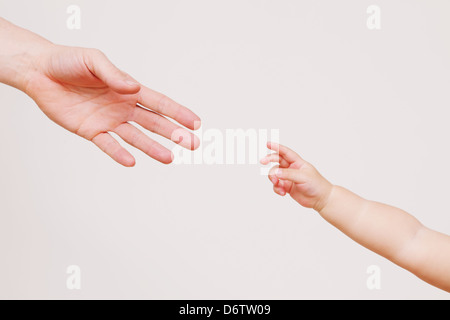Two hands reaching out, stretching, holding isolated on white ...