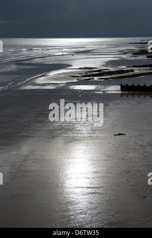 Sunshine on Hastings beach after a spring rain storm Stock Photo - Alamy