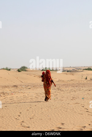 India, Rajahstan, Jaisalmer, Thar Desert, Sam Dunes, two people riding ...