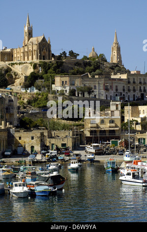Our Lady of Lourdes church overlooking Mgarr harbour on the island of ...