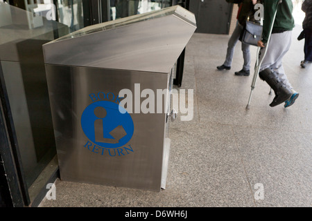 Public library book return drop box Stock Photo - Alamy