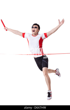 Male athlete with relay baton Stock Photo - Alamy