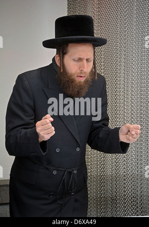 Religious Jewish man in fervent prayer at the Ohel, the resting place ...