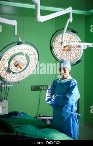 smiling female doctor in headscarf with offering gesture with space ...