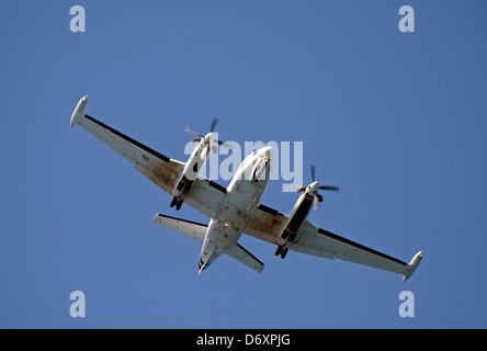 Bottom view of airplane flying above skyscrapers Stock Photo - Alamy