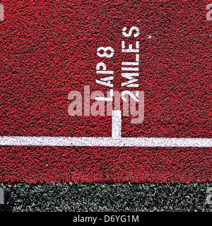 Track and field 1 mile marker Stock Photo - Alamy
