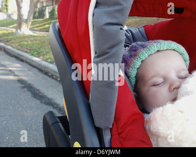 Baby sleeping in stroller Stock Photo - Alamy
