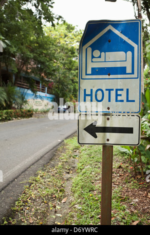 Hotel sign showing vehicles where to stop, Costa Rica Stock Photo - Alamy