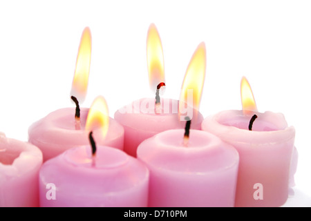 Pink burning candles isolated on white background Stock Photo - Alamy