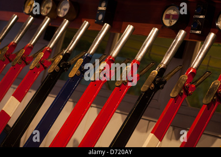 Railway signal control levers and brass labels in a restored signal box ...