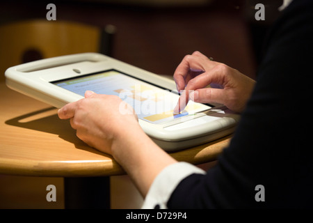 nurse using apple ipad in protective case Stock Photo - Alamy