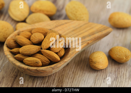 almond without shell on the wooden table Stock Photo - Alamy