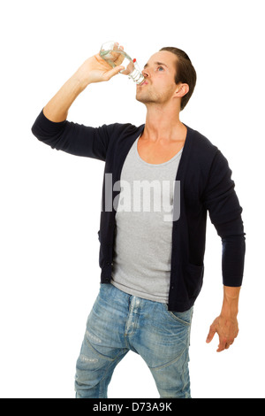 Guy drinking water isolated on studio background. Man enjoy pure ...