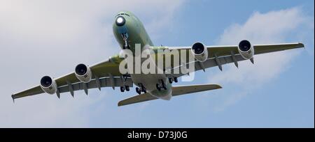 An unpainted Airbus A380 aircraft arrives at the Airbus production ...