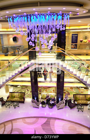 P&O Cruise ship Azura Atrium. The atrium has 2 glass elevators which go ...