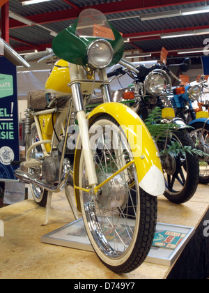 The Yellow Flandria mopet is a vintage scooter known for its sleek ...
