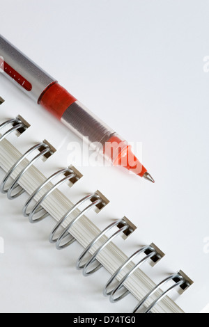 Vertical shot of a blank notepad with space for text on the table with ...