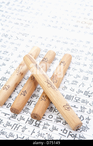 Yut sticks on a paper with traditional Korean words Stock Photo - Alamy