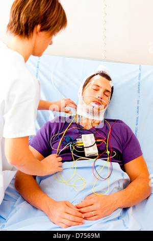 Man undergoing polysomnographic examination polysomnography study ...