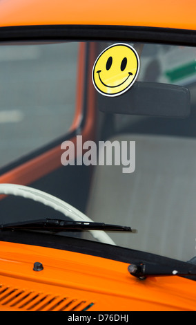 Smiley face sticker on a Volkswagen Beetle windscreen Stock Photo - Alamy