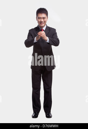 Businessman Bowing Toward Camera Stock Photo - Alamy