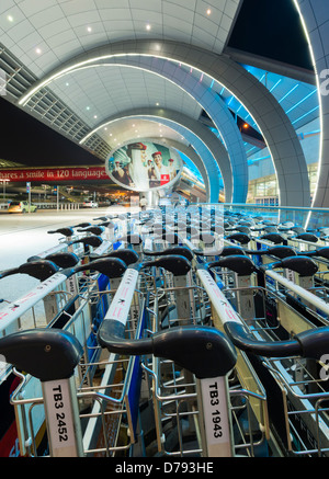 Luggage Trolleys, Dubai International Airport UAE Stock Photo - Alamy