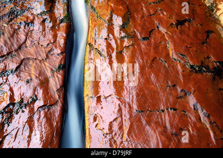 River water cuts through flows funnels funneled through a crack in the ...