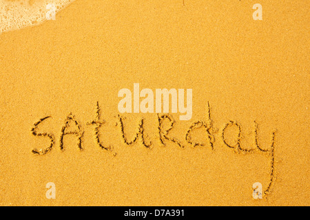 Saturday - written in sand on beach texture (soft wave of the sea Stock ...