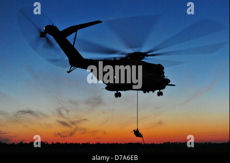 US Special Operations Forces fast-rope from an MH-47 Chinook helicopter ...