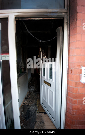 Severe house fire front door UPVC Burnt Melted Stock Photo - Alamy