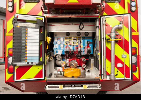 Fire engine rear pump locker with hose attached Stock Photo - Alamy