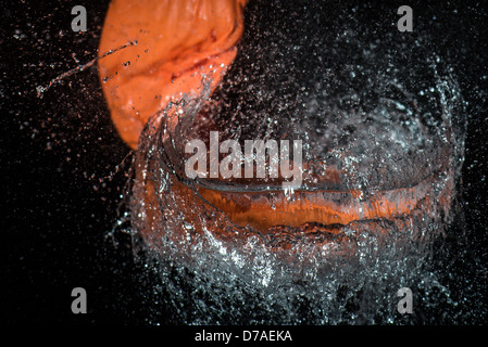 balloon filled with water exploding Stock Photo - Alamy